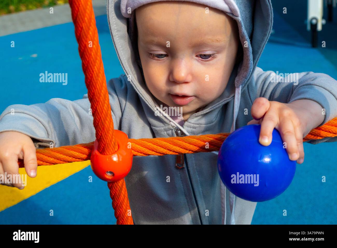Amused boy on playground hi-res stock photography and images - Alamy