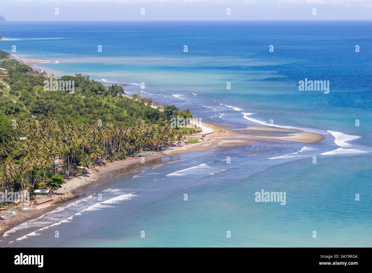 Scenic distant view of the beach with rolling waves in Malita, Davao ...