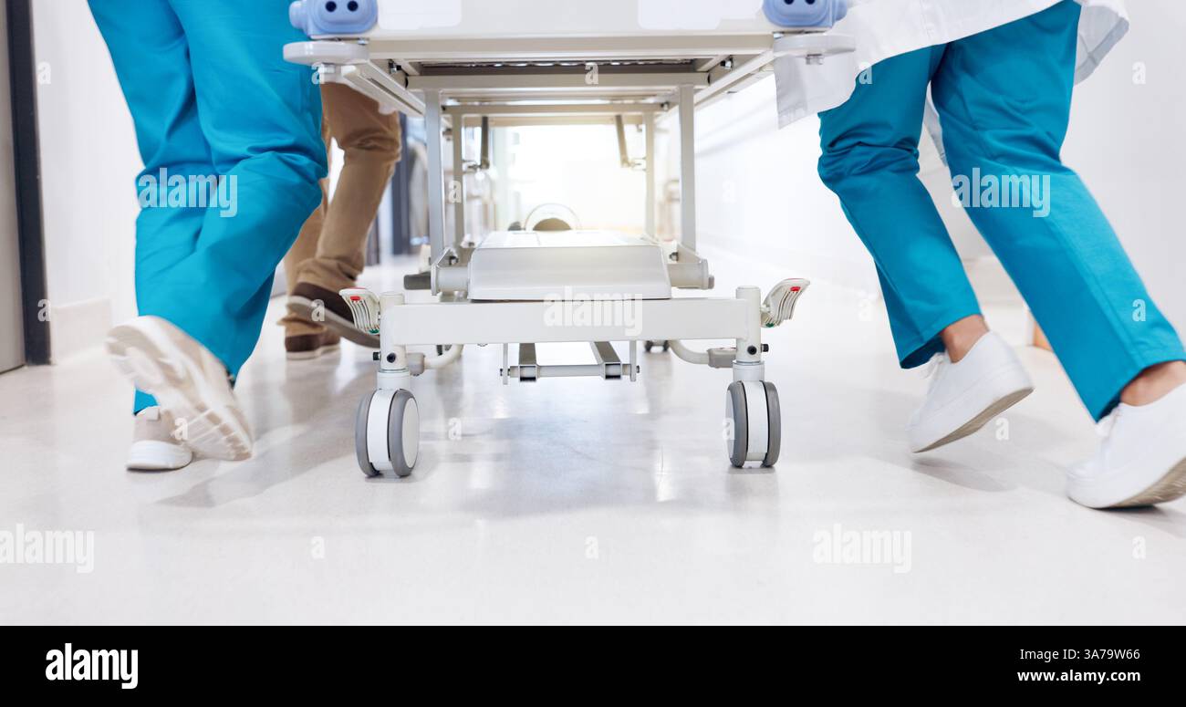 Running, hospital and doctors with gurney for emergency, surgery and ...