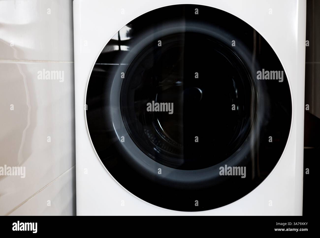 Modern white washing machine. concept of doing laundry Stock Photo - Alamy