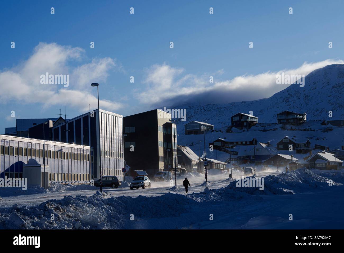 A woman walks along a street in Nuuk, Greenland, March 5, 2025. (AP ...