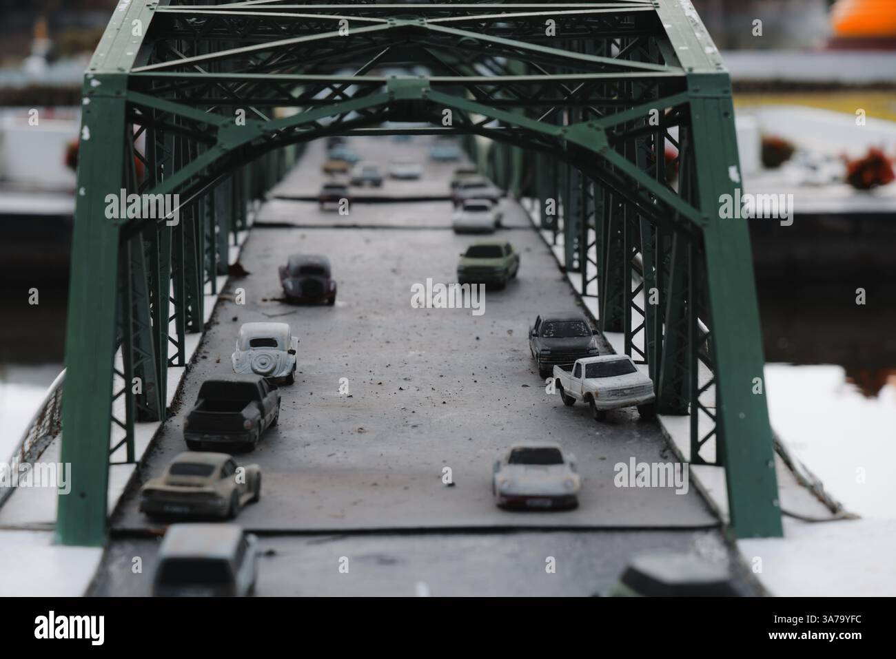 A CloseUp Perspective of a Miniature Bridge Featuring Various Cars and ...
