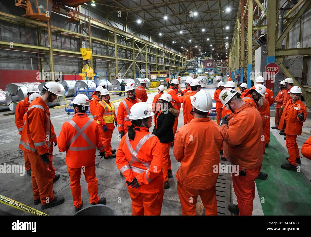 Steel workers gather at the ArcelorMittal Dofasco steel plant in Hamilton, Ont., on Wednesday ...