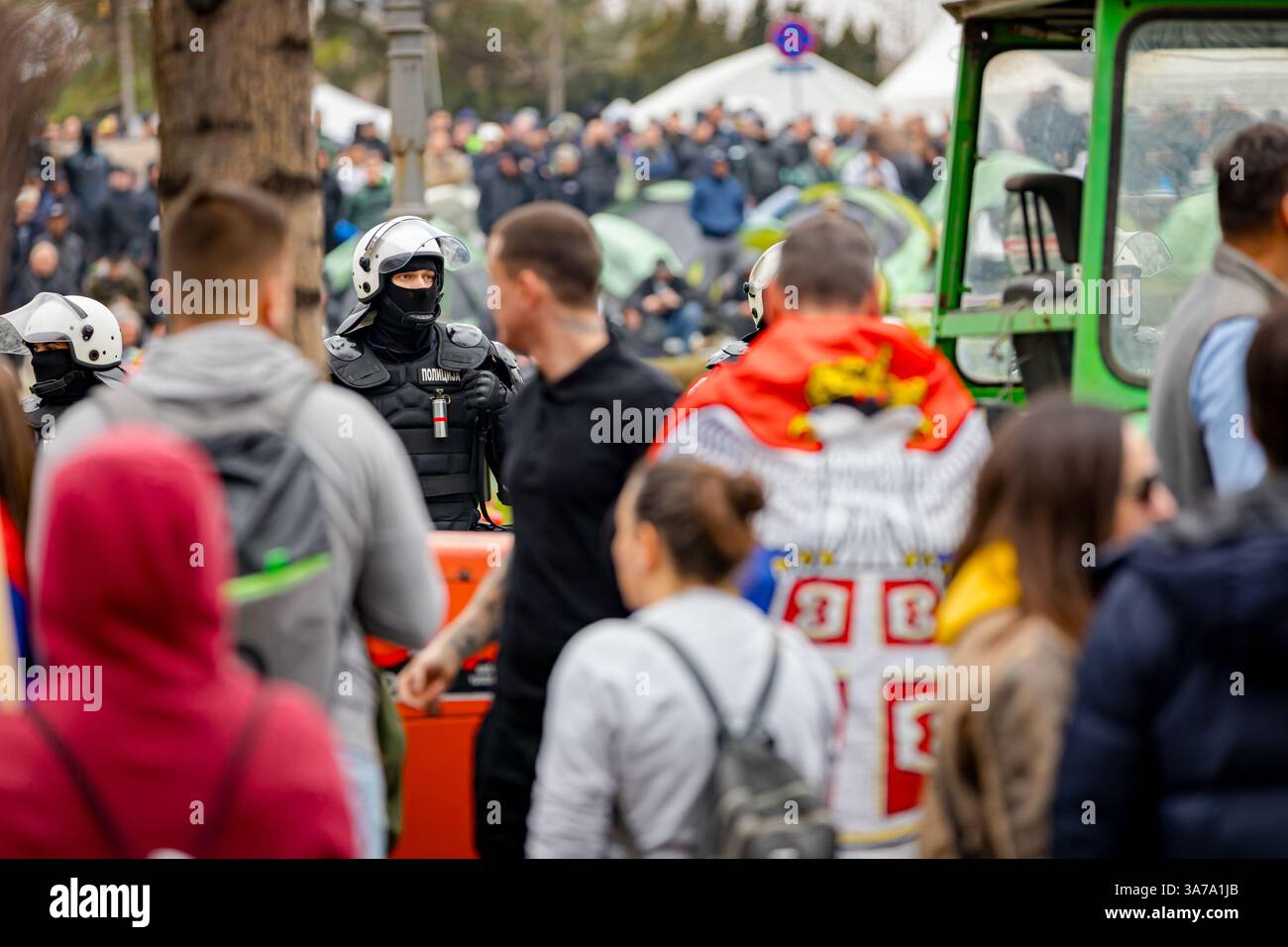 Riot police with full equipment stand guard in cordon, helmet, mask ...