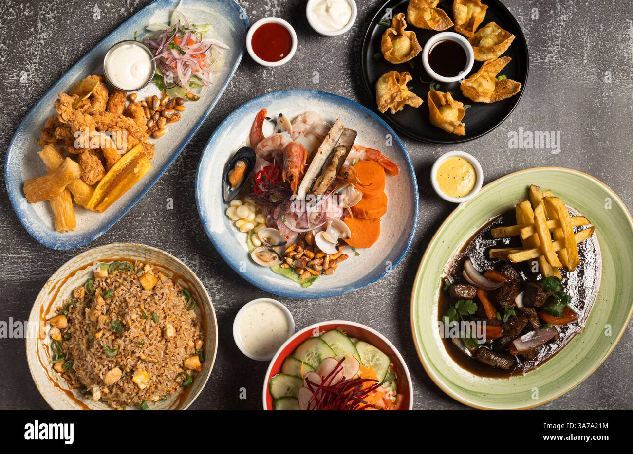 Delicious peruvian food including ceviche, lomo saltado, fried wontons ...