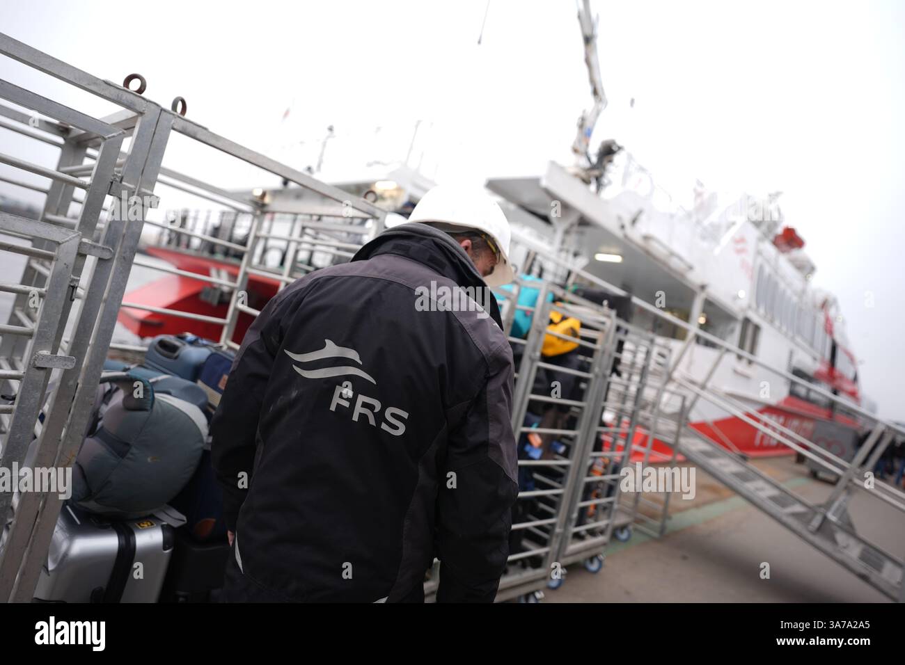 Hamburg, Germany. 27th Mar, 2025. Crew members of the HSC "Halunder Jet ...