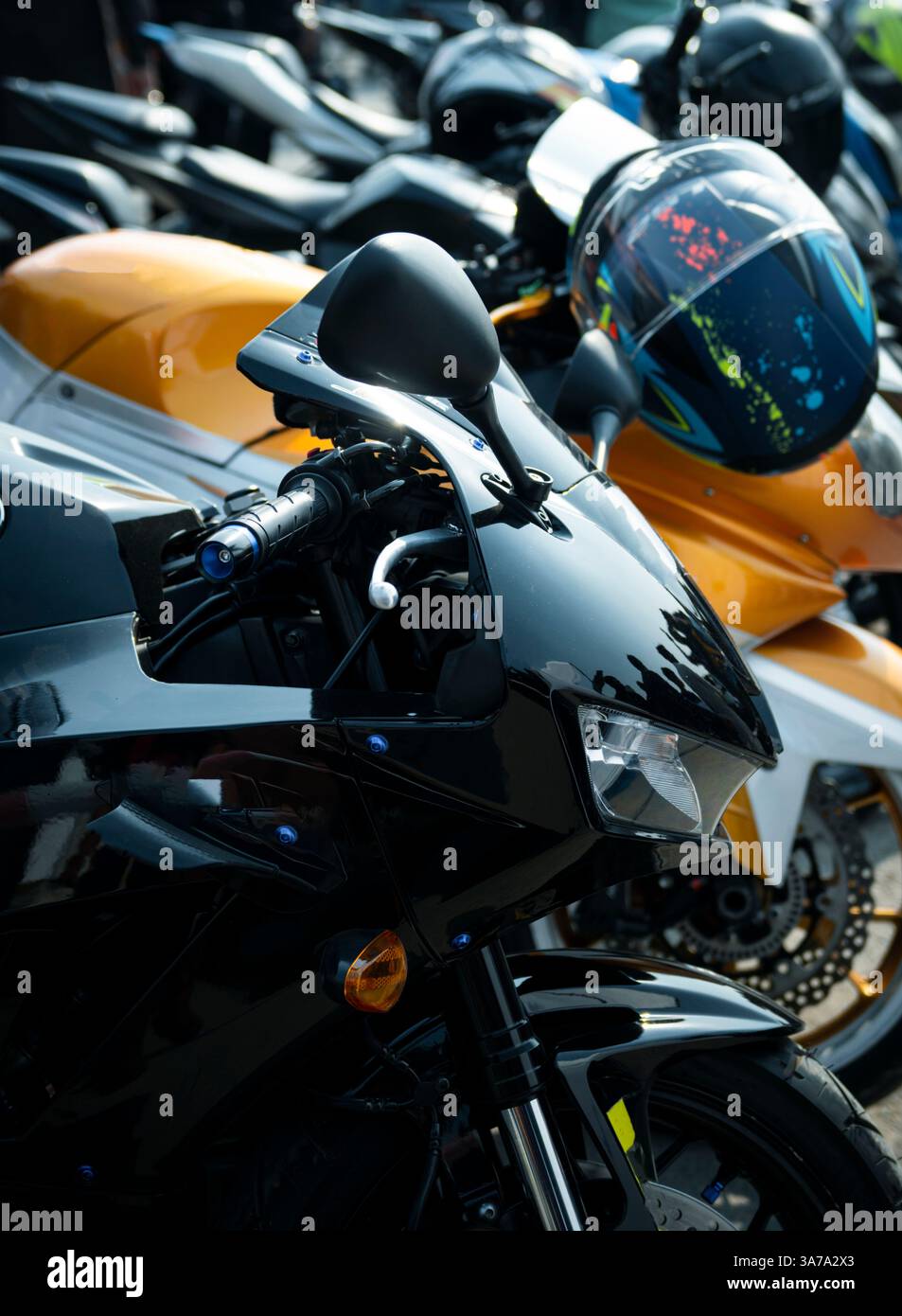 A dynamic lineup of sports bikes with helmets, ready for racing and ...