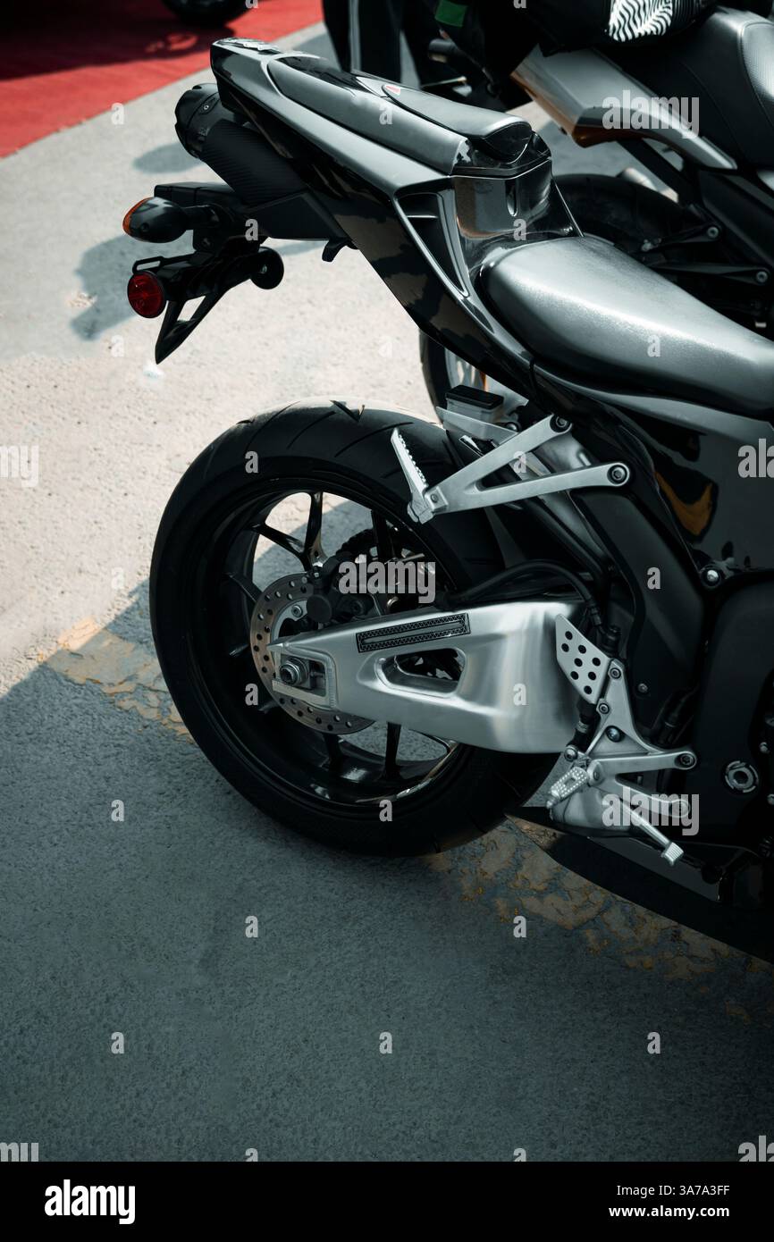The sleek rear view of a black and silver heavy bike, highlighting its ...