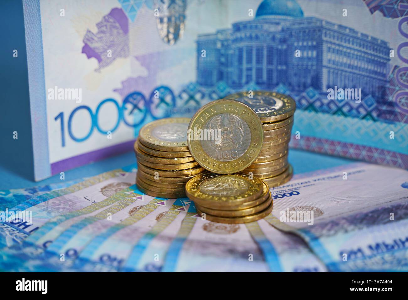 Coins, tenge banknotes on the background of an oil rocking chair and ...