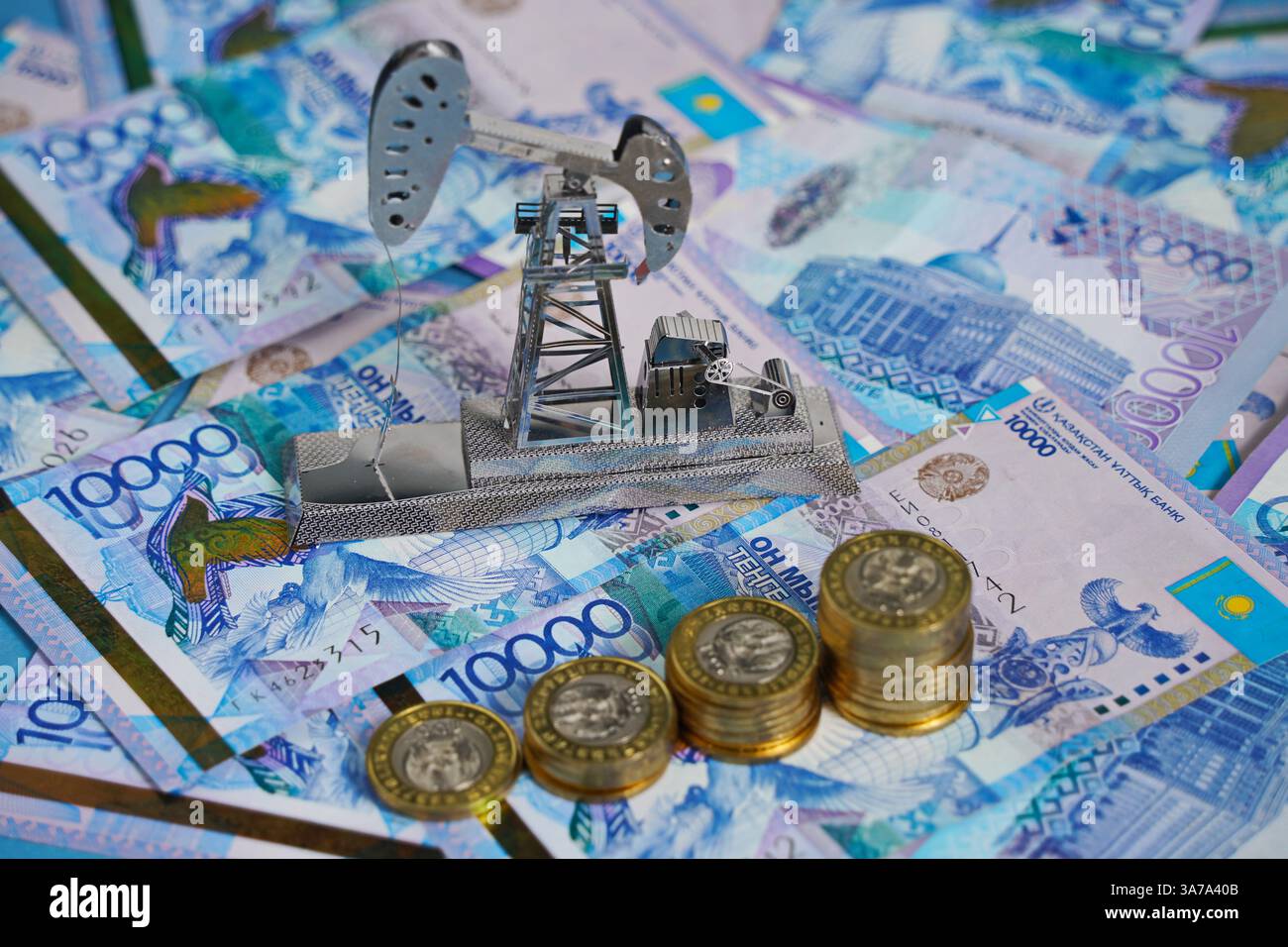 Coins, tenge banknotes on the background of an oil rocking chair and ...