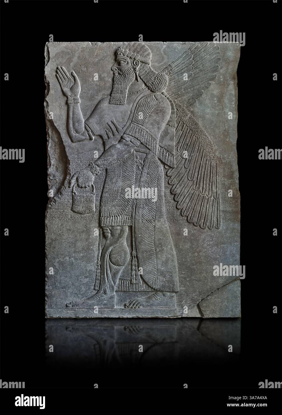 Ancient Neo Assyrian palace relief sculpture depicting a bearded Winged ...