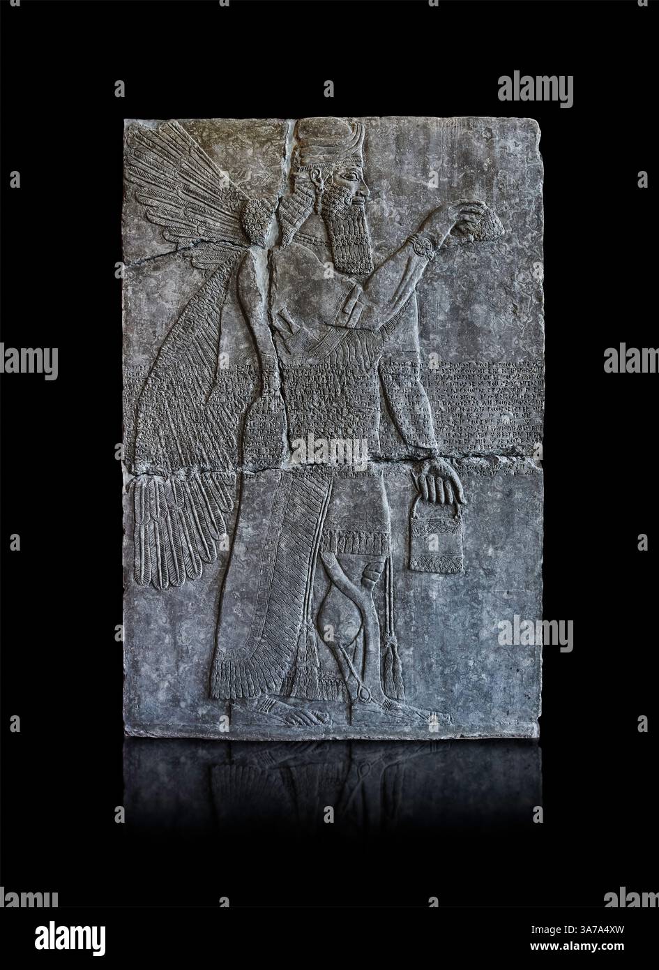 Ancient Neo Assyrian palace relief sculpture depicting a bearded Winged ...