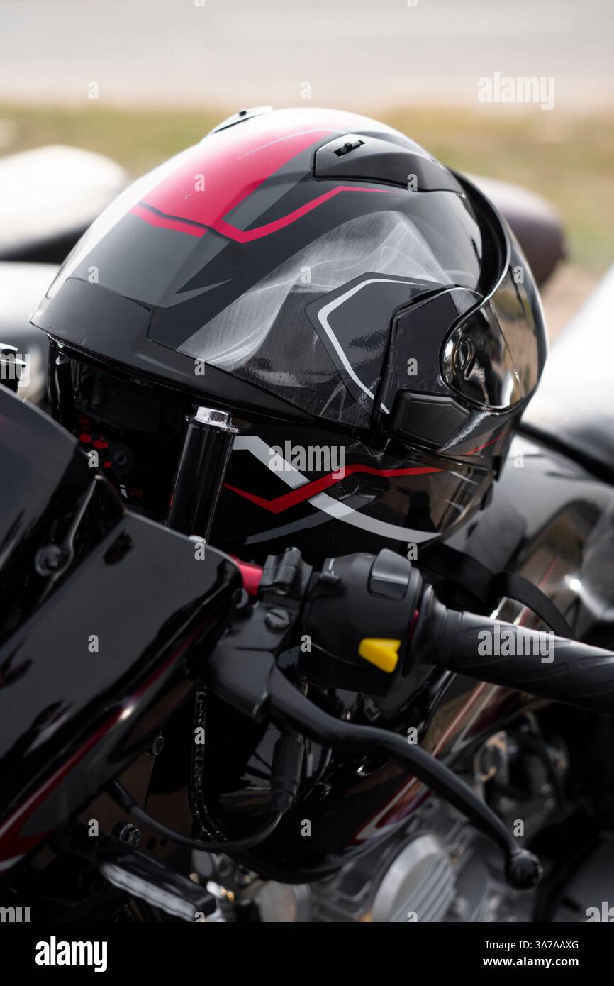 A premium helmet resting on a high-speed sports bike, highlighting the ...