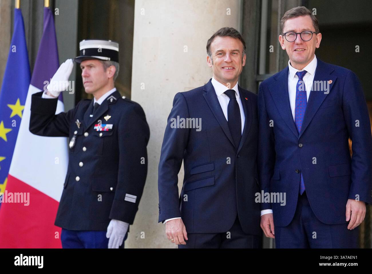 French President Emmanuel Macron, center, poses with Estonia's Prime ...