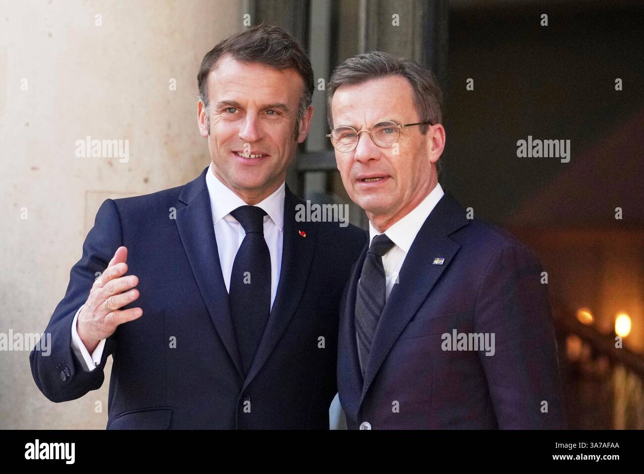 French President Emmanuel Macron, left, greets Sweden's Prime Minister ...