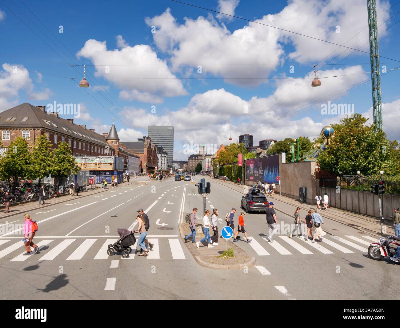 Urban streetscape with people crossing Bernstorffsgade pedestrian ...