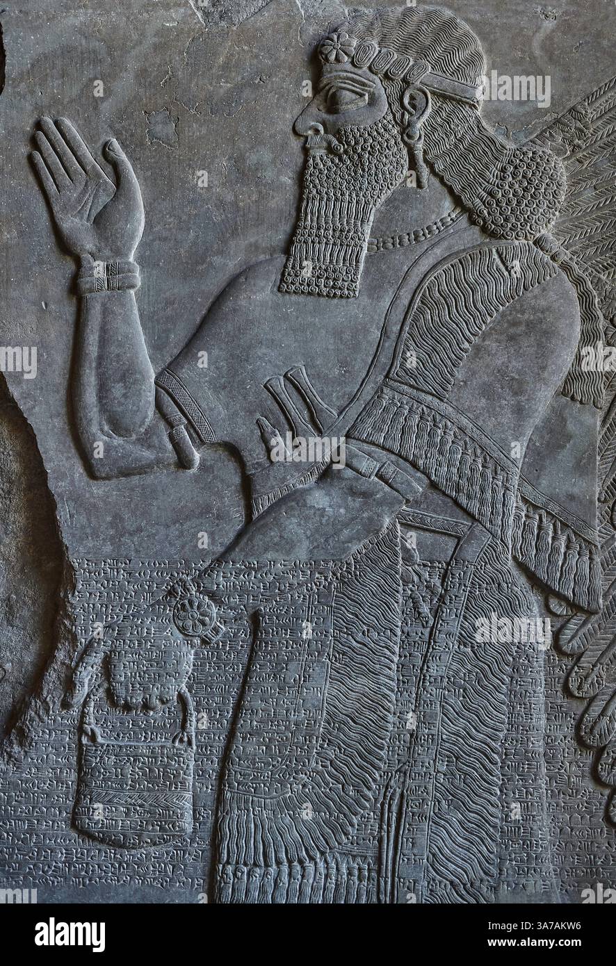 Ancient Neo Assyrian palace relief sculpture depicting a bearded Winged ...