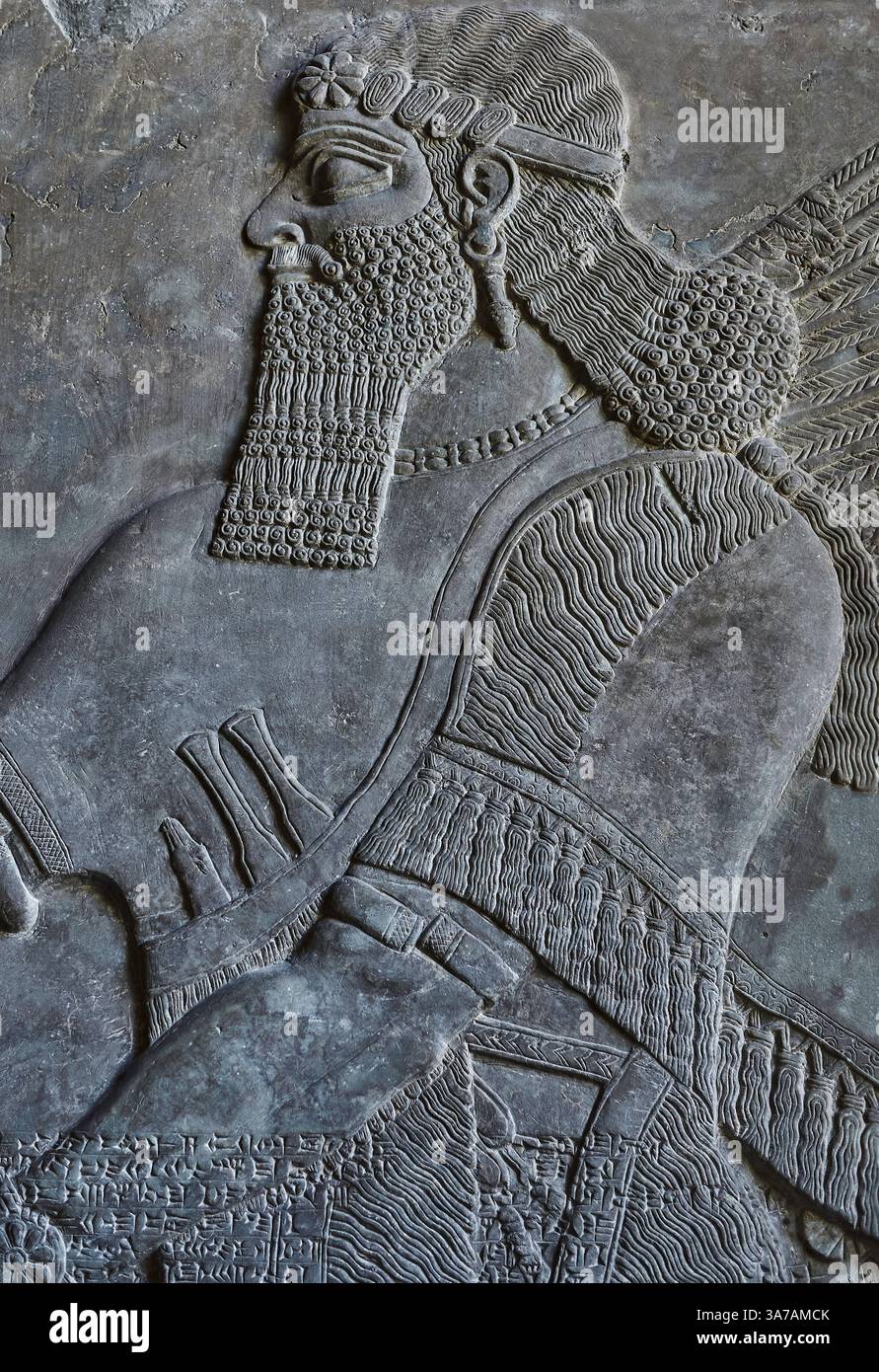Ancient Neo Assyrian palace relief sculpture depicting a bearded Winged ...