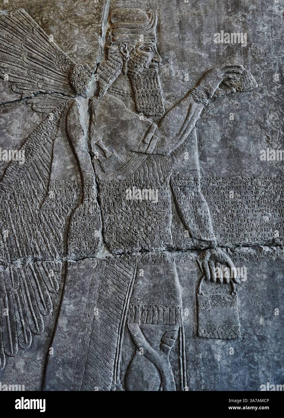Ancient Neo Assyrian palace relief sculpture depicting a bearded Winged ...