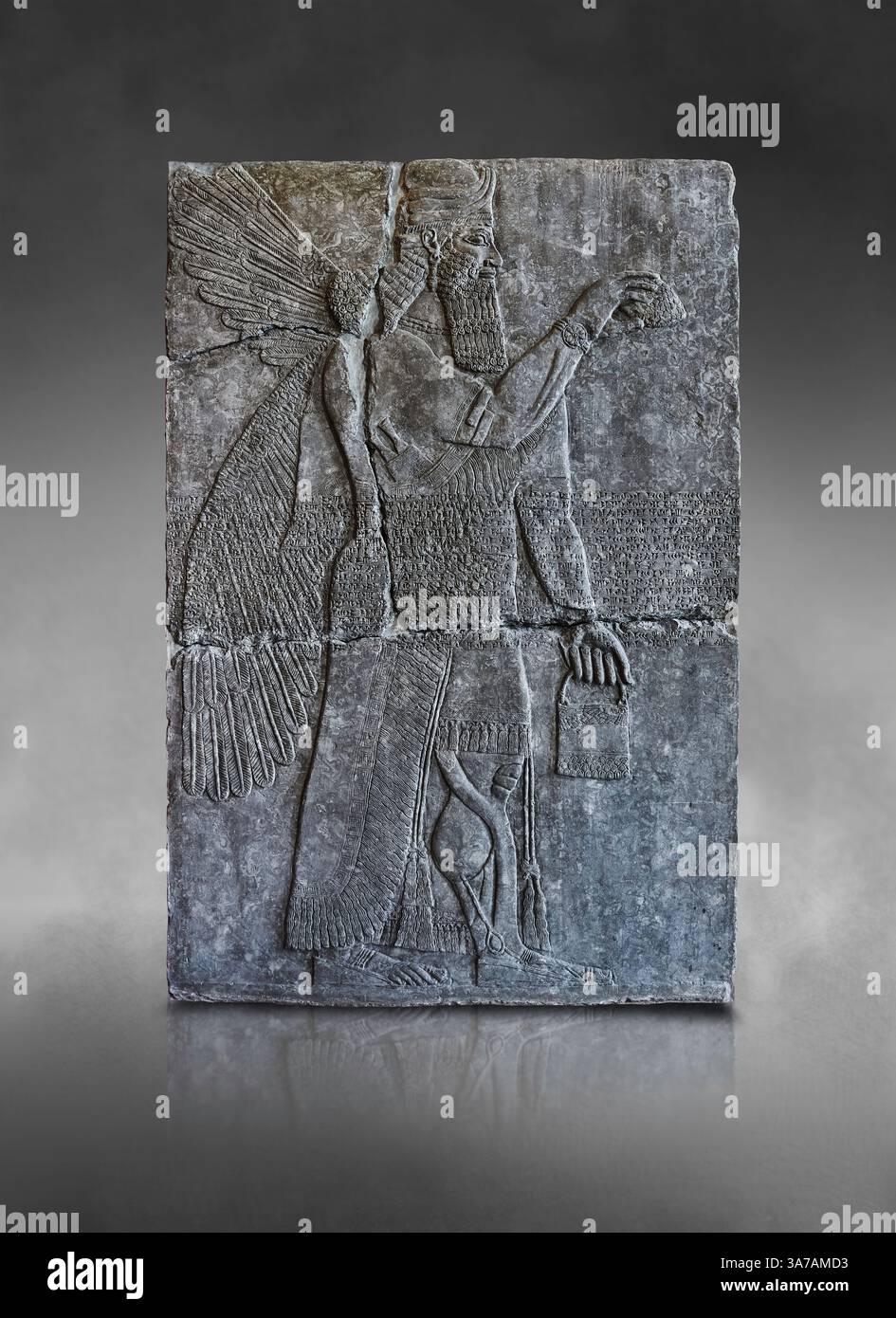 Ancient Neo Assyrian palace relief sculpture depicting a bearded Winged ...