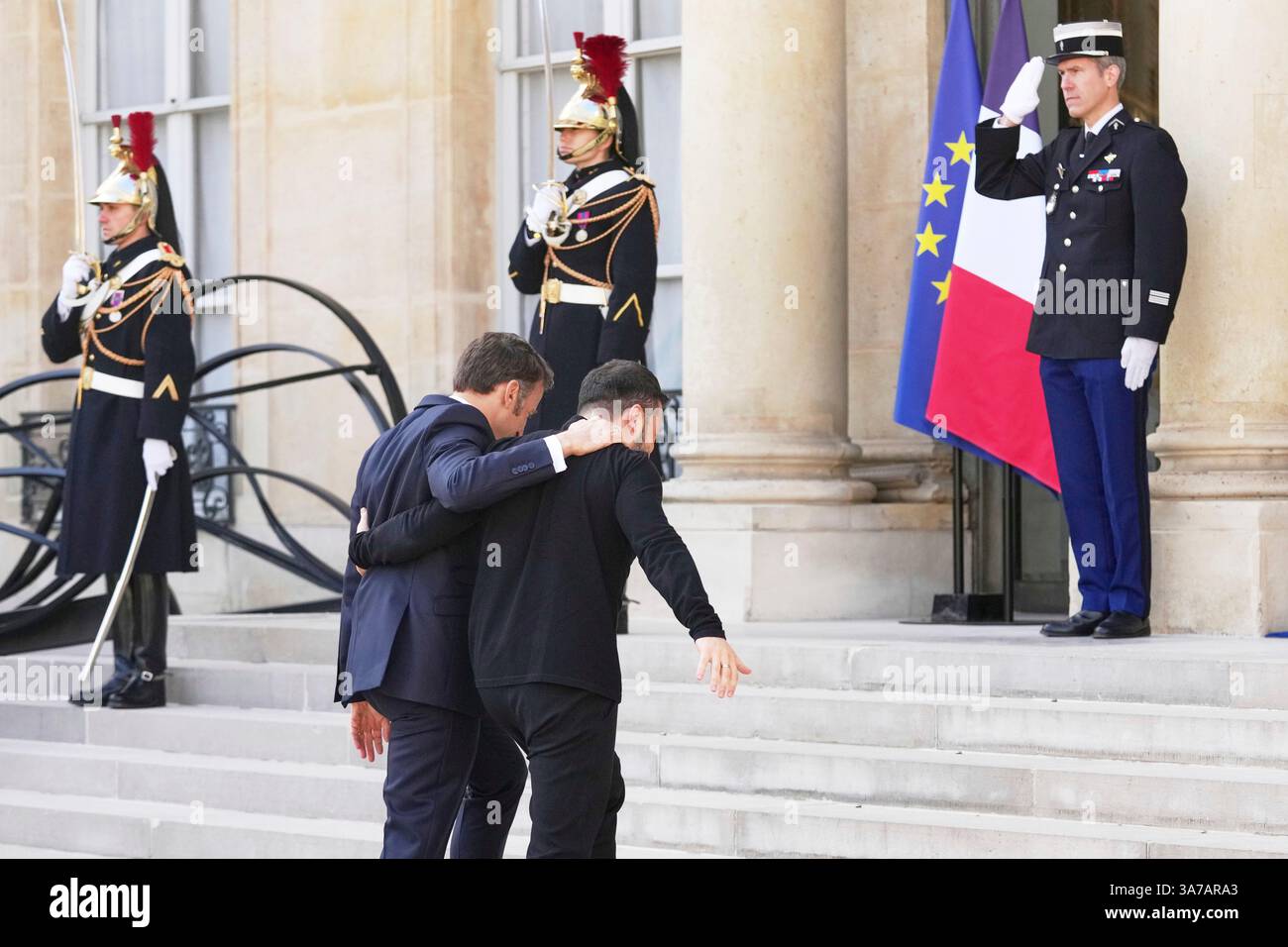 French President Emmanuel Macron, center left, walks with Ukraine's ...