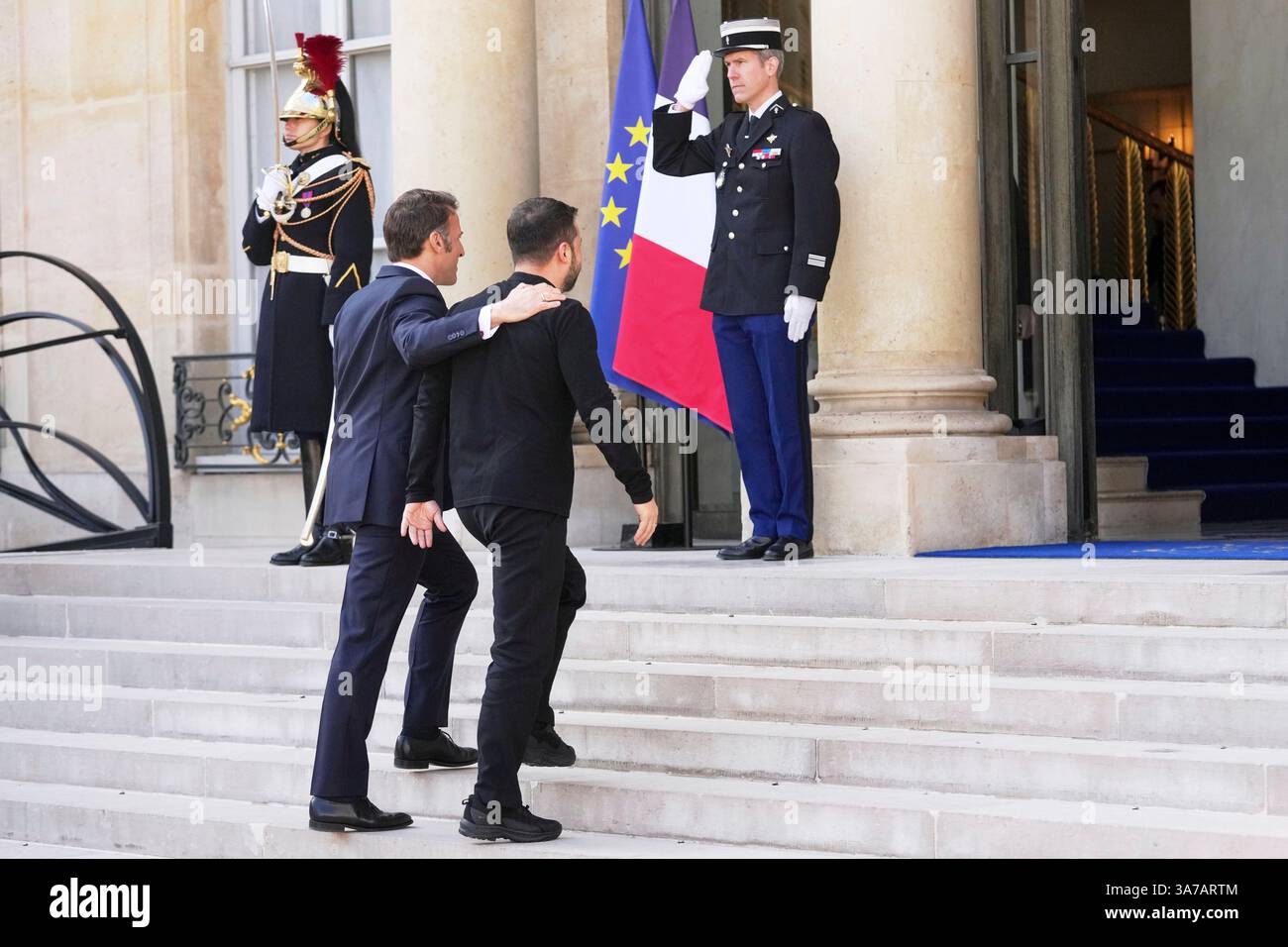 French President Emmanuel Macron, center left, walks with Ukraine's ...