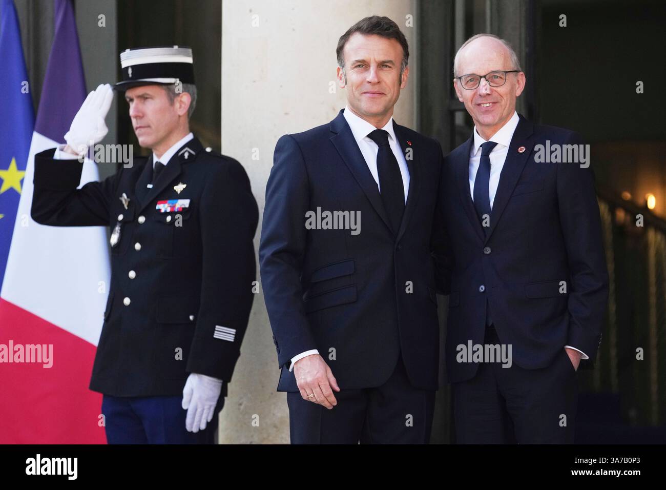 French President Emmanuel Macron, center, greets Luxembourg's Prime ...