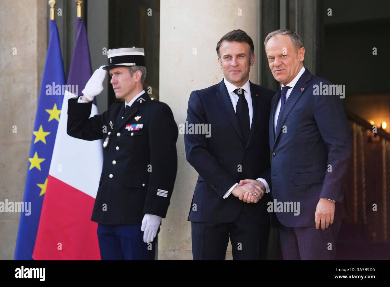 French President Emmanuel Macron, center, greets Poland's Prime ...