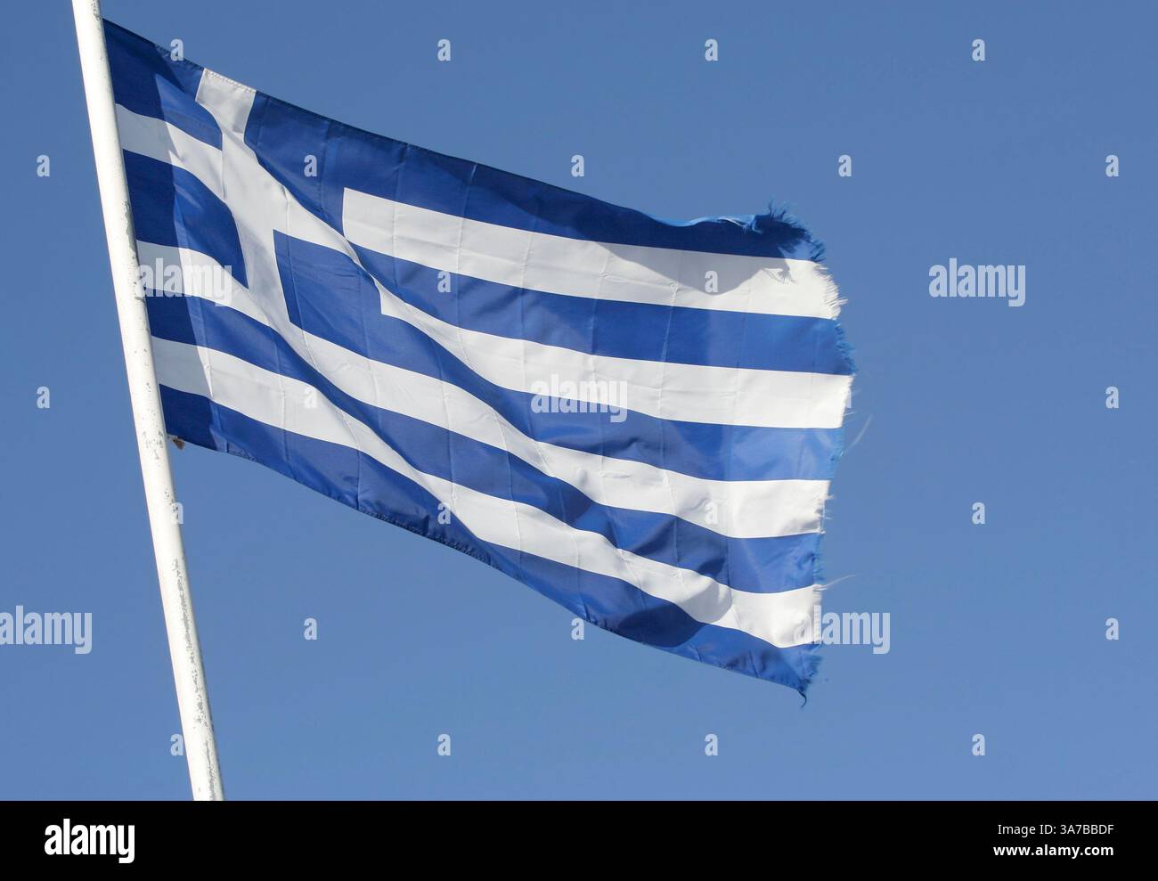 National Flag of Greece flying in The Air with Blue Sky Background in ...