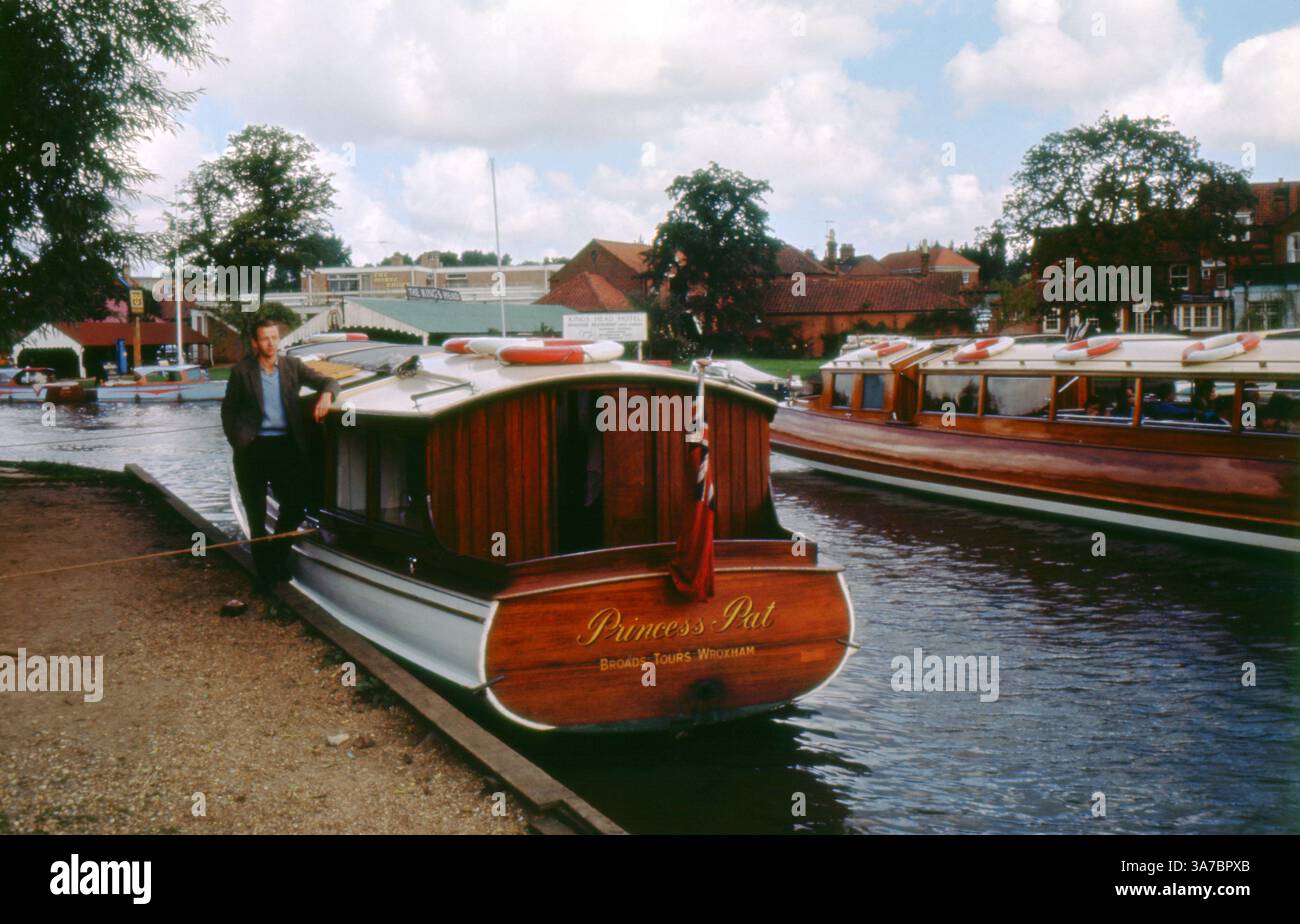 A scenic view of Wroxham on the Norfolk Broads, taken in the 1960s. A ...