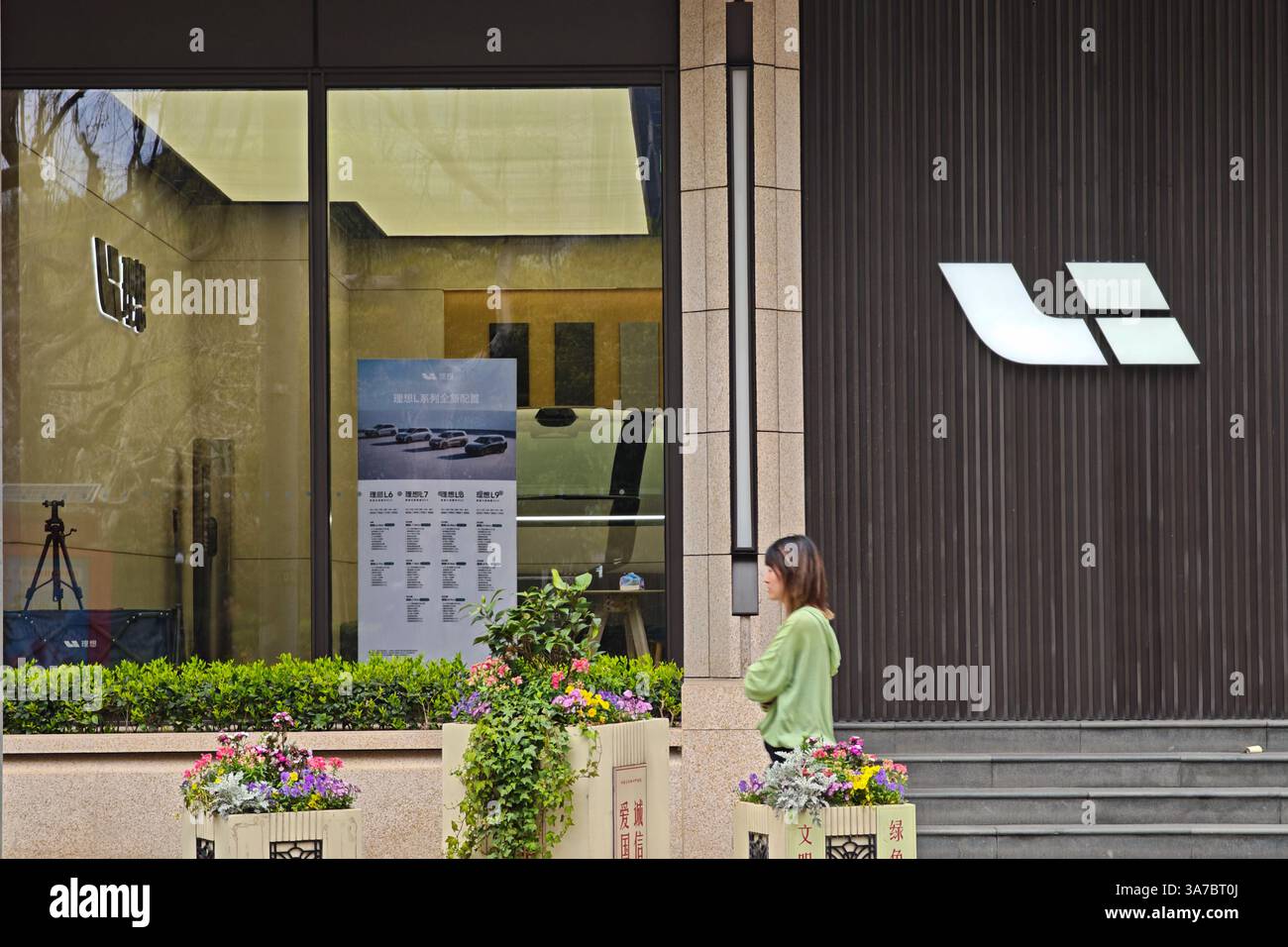SHANGHAI, CHINA - MARCH 27, 2025 - Pedestrians pass an Li auto flagship ...