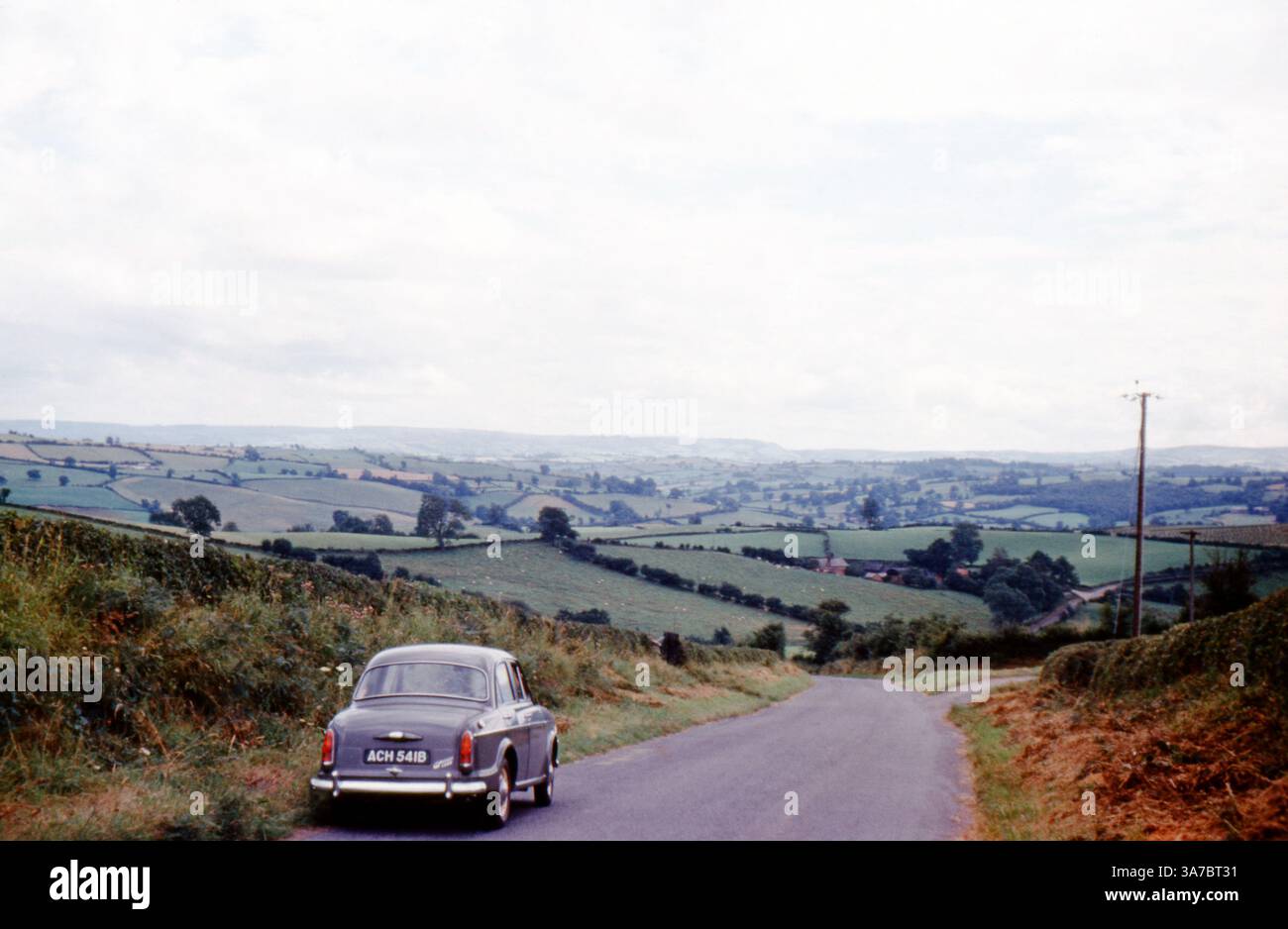 A peaceful 1960s moment captured in the British countryside, showing a ...