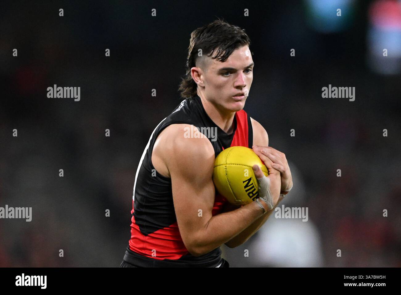 Archie Roberts of Essendon marks the footy during the AFL Round 3 match ...