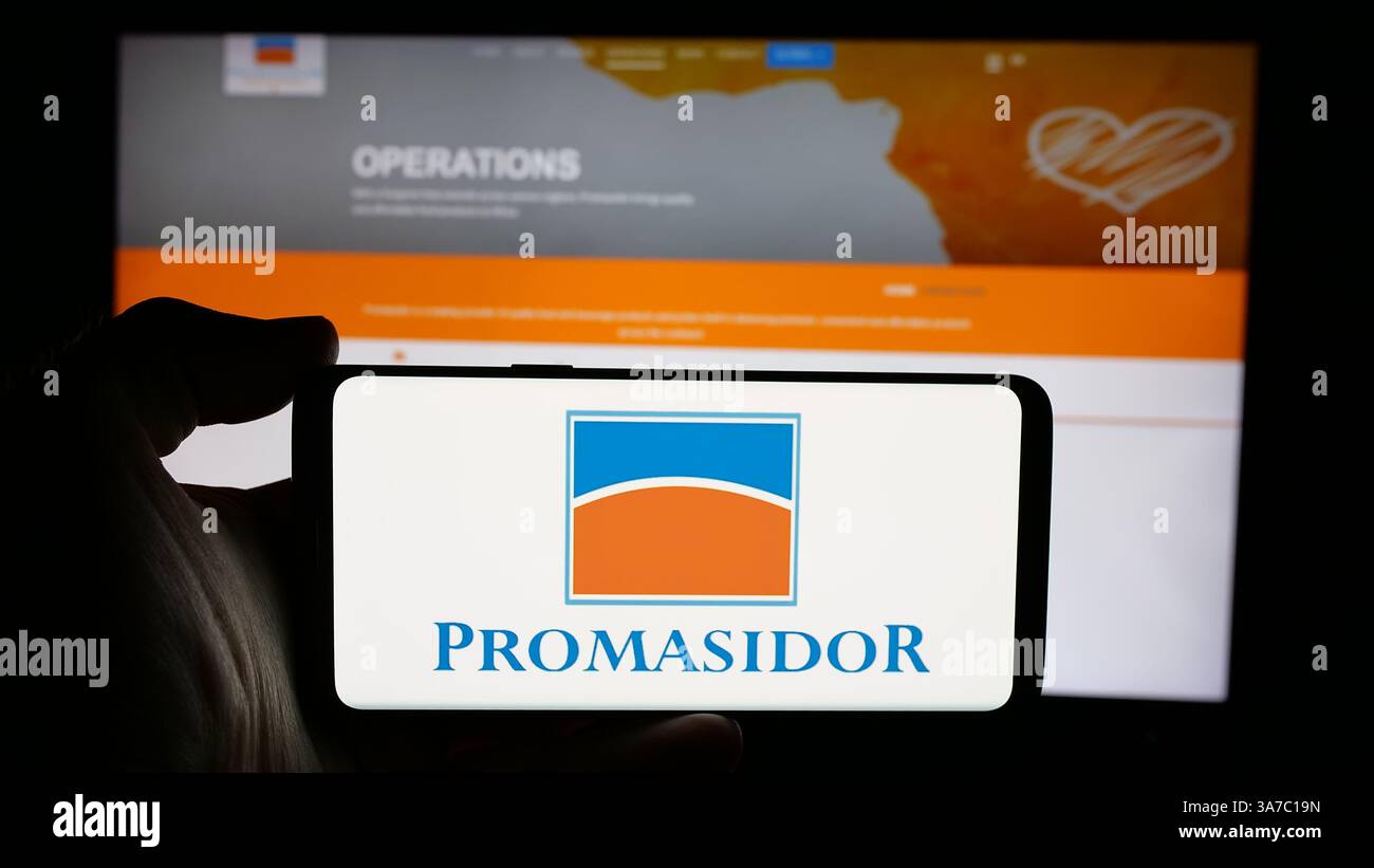 In this photo illustration, a person is holding a cellphone with the ...