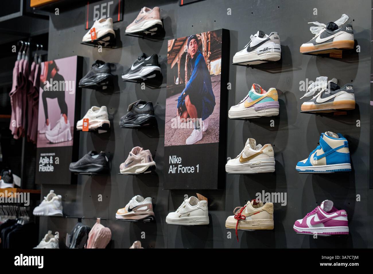 Various models of women's Nike sports shoes displayed at Nike store ...