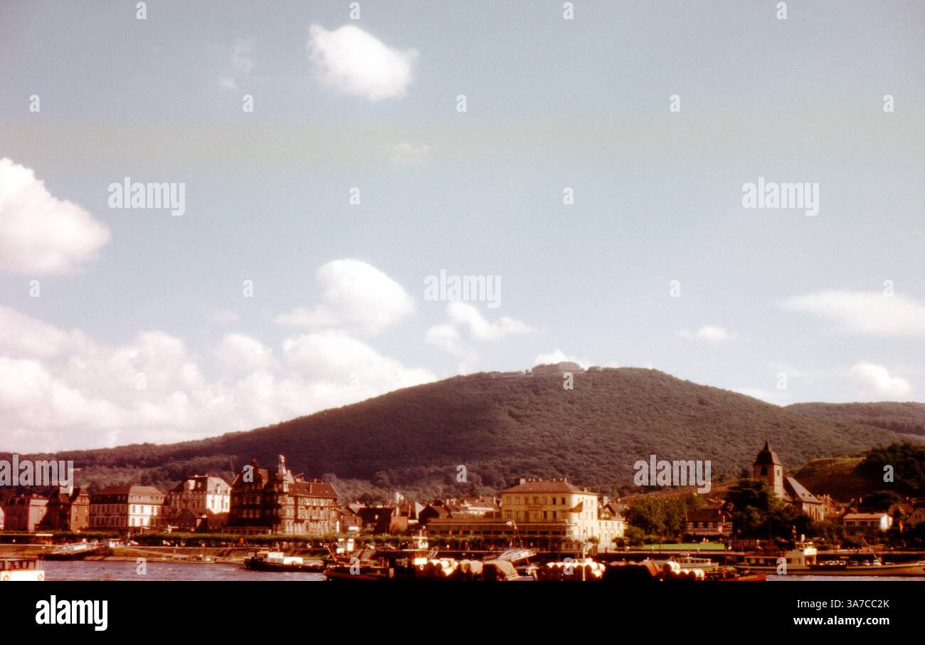 A scenic 1960s view of the Rhine River with the historic town of ...