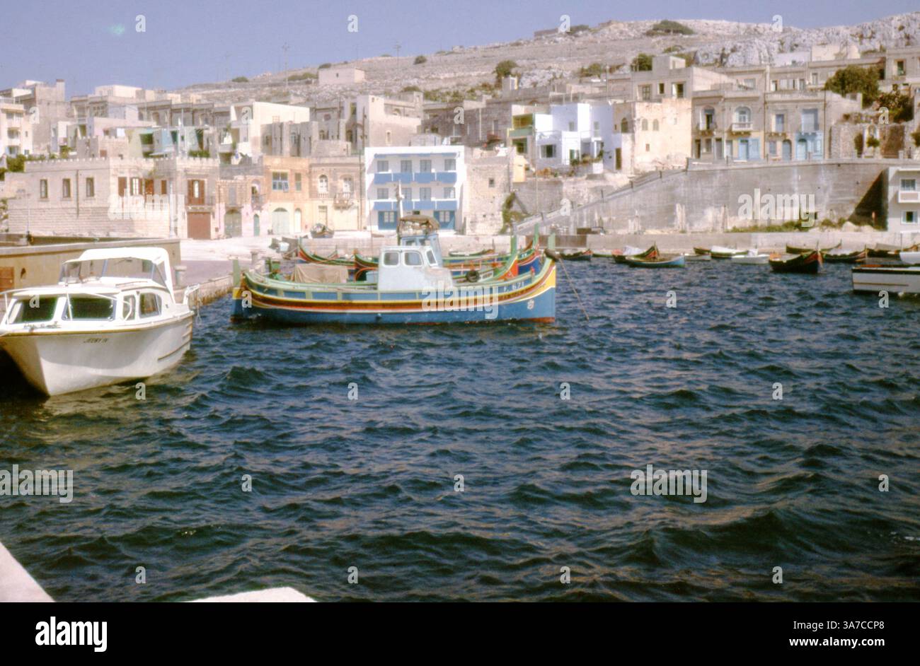 A vibrant 1970s view of St. Paul’s Bay in northern Malta, with ...