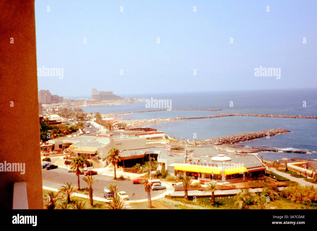 A vibrant 1960s view of Playa de las Américas in San Eugenio, Tenerife ...