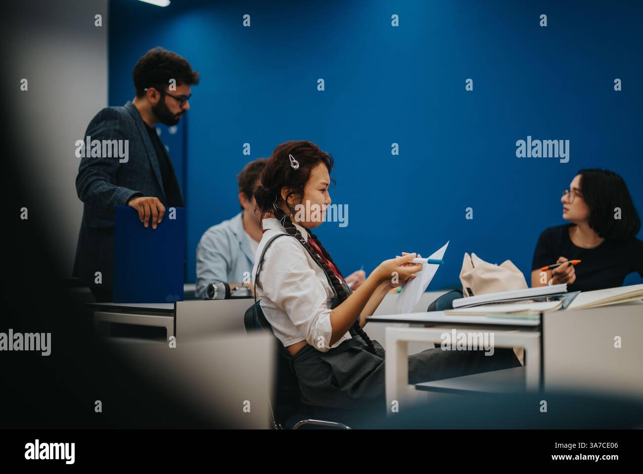 Students engaged in lively discussion during classroom session Stock ...