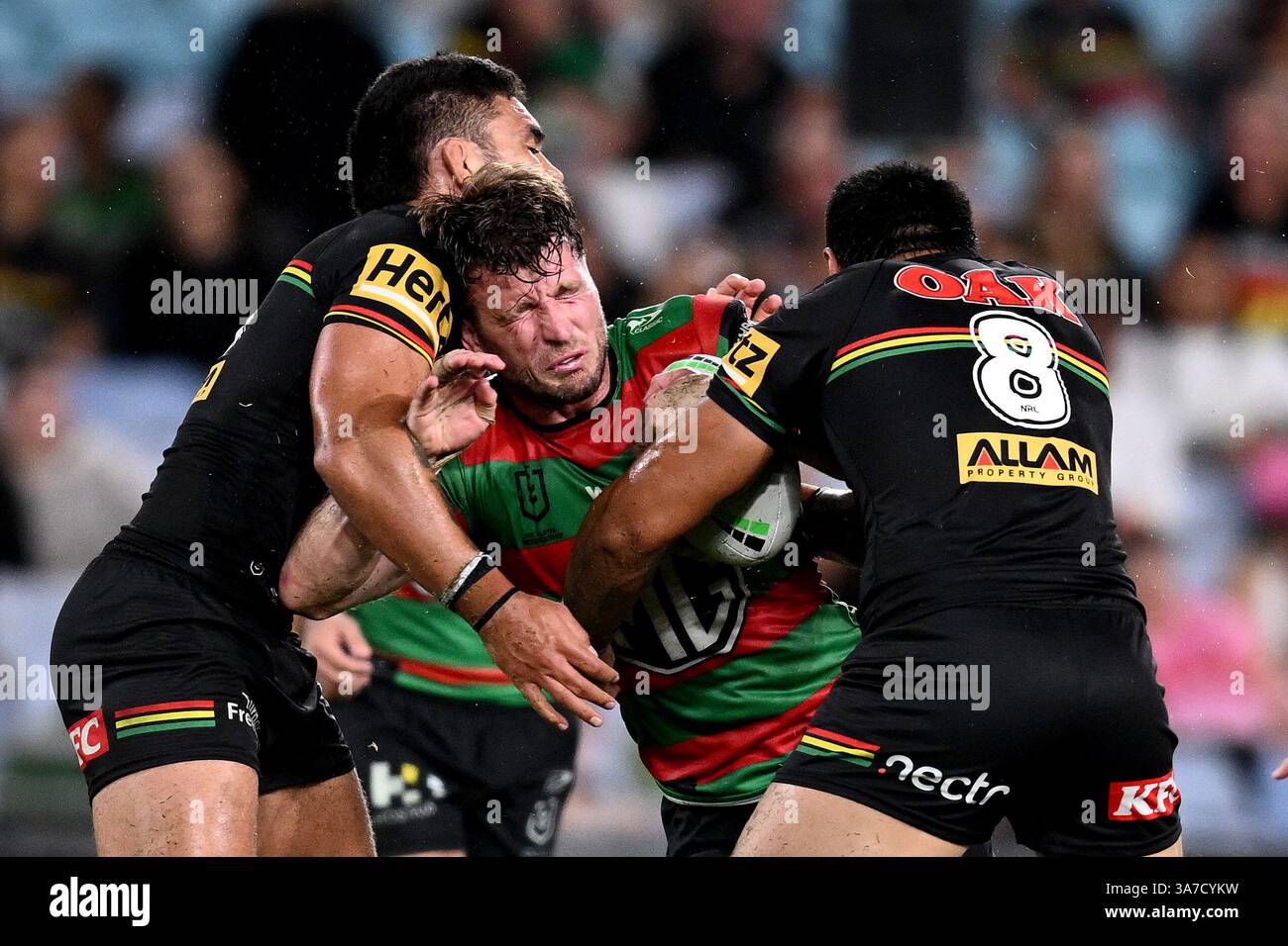 Sydney, Australia. 27th Mar, 2025. Jai Arrow of the Rabbitohs is tackled by Isaiah Papali'i ...
