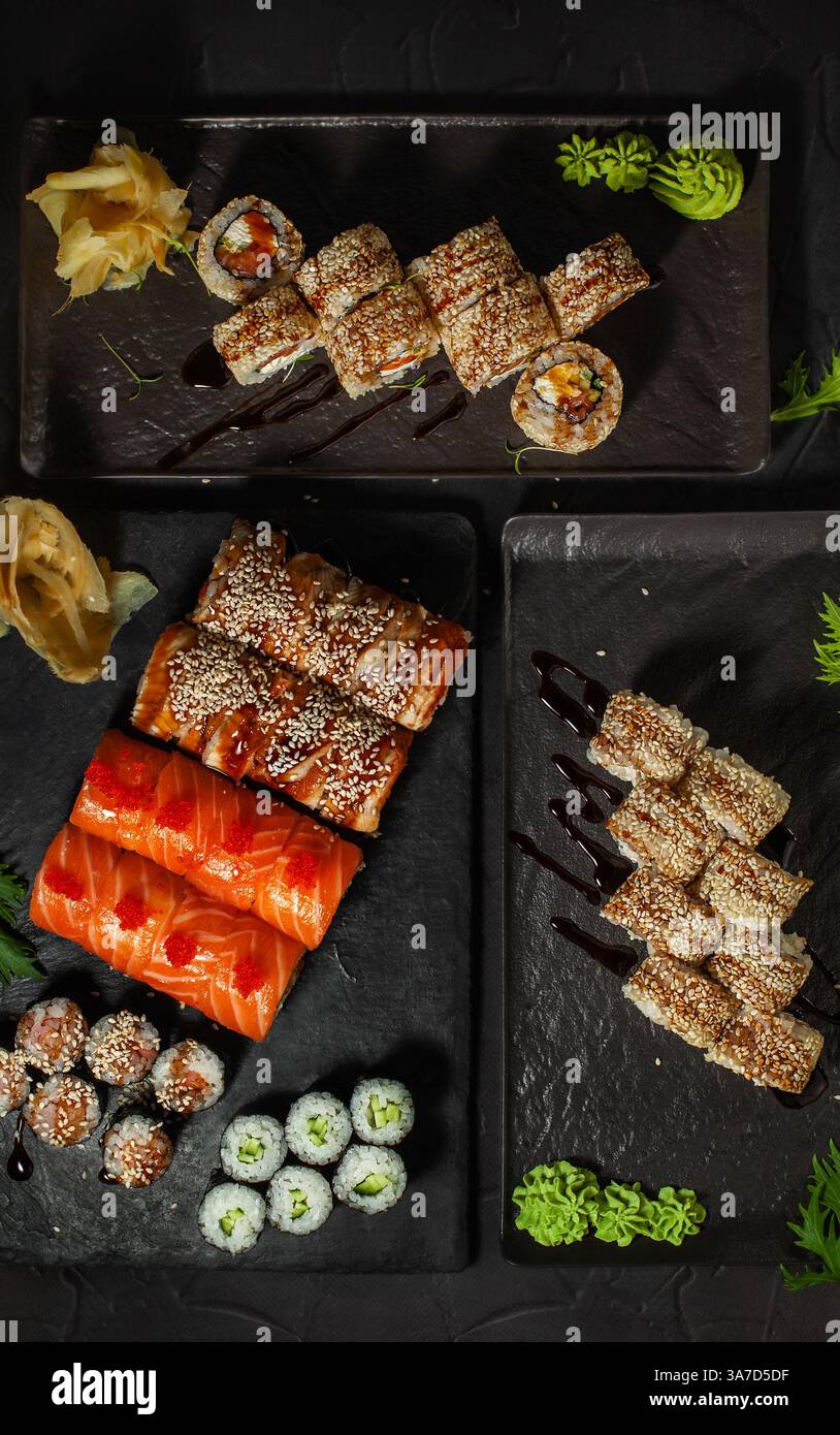 three plates with sushi rolls, top view Stock Photo - Alamy