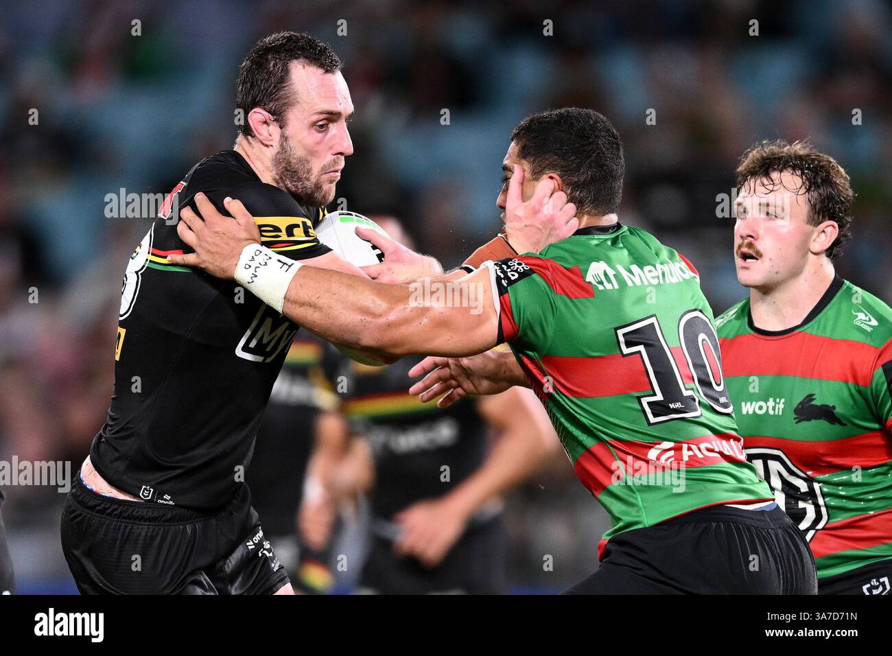 Isaah Yeo of the Panthers is tackled by Davvy Moale of the Rabbitohs ...