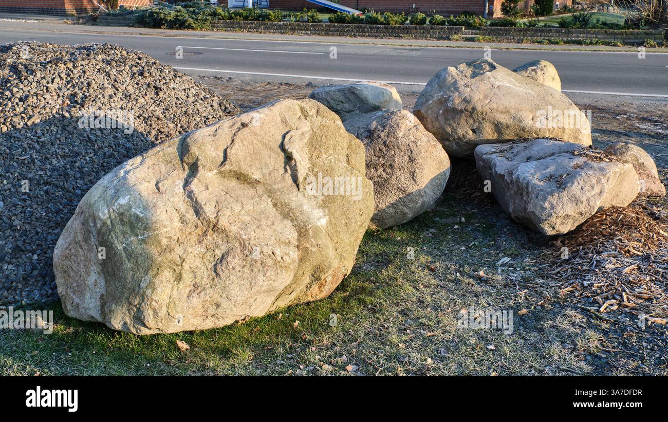 A collection of large boulders and a gravel pile, prepared for ...