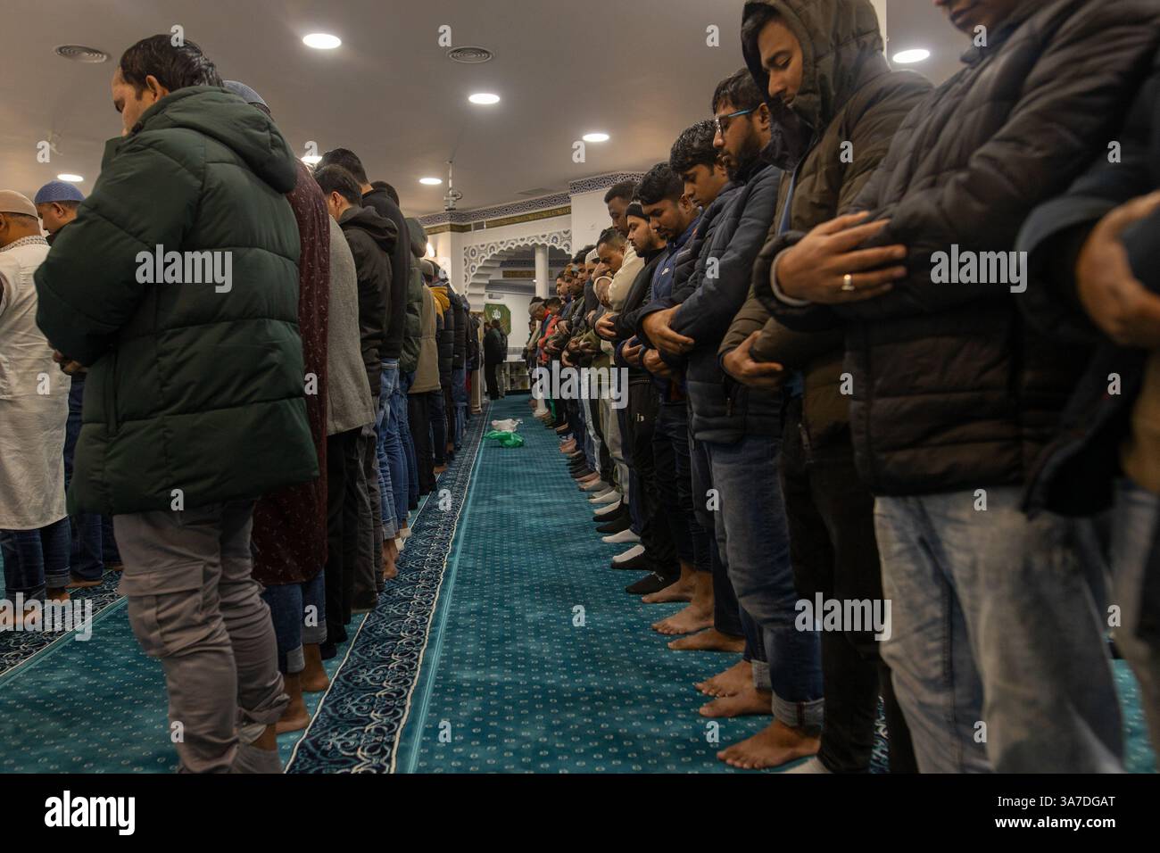 Madrid, Spain. 26th Mar, 2025. Male muslim devotees pray inside a ...