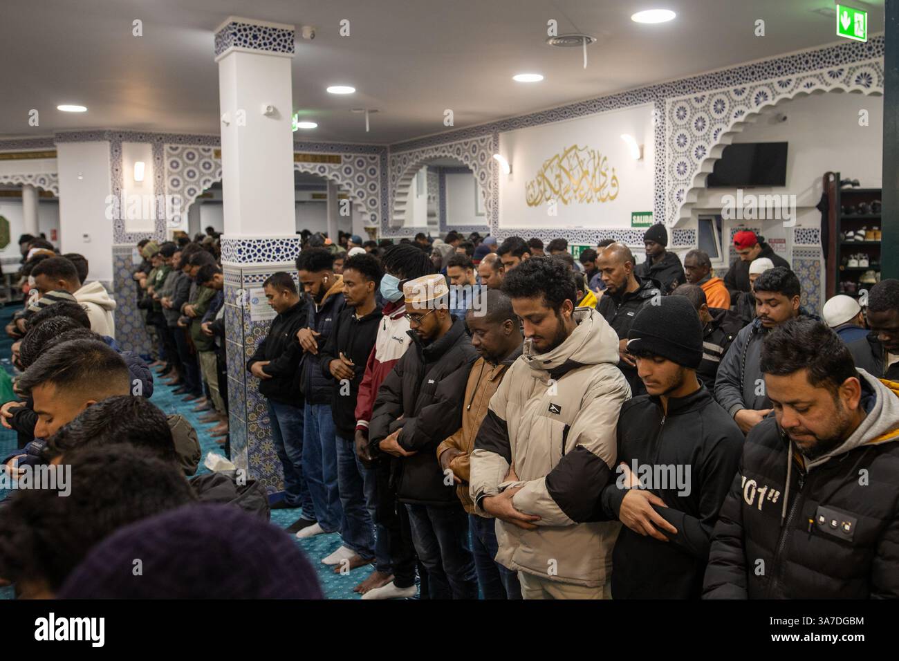 Madrid, Spain. 26th Mar, 2025. Male muslim devotees pray inside a ...