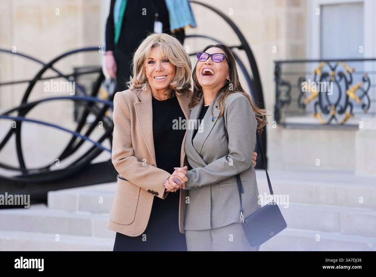 French first lady Brigitte Macron, left, poses with Brazil's first lady ...