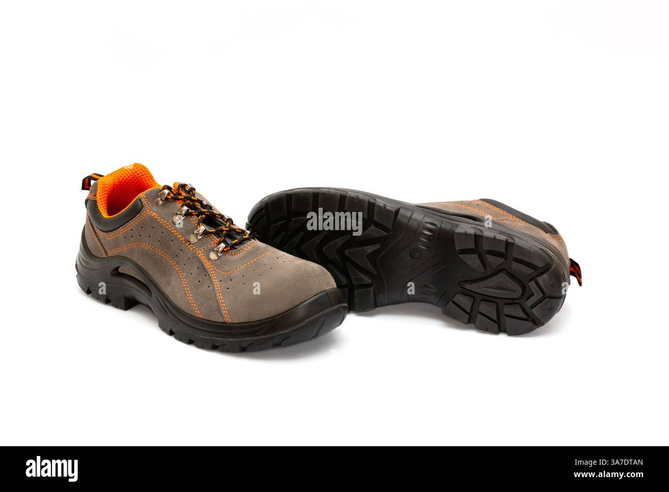 Brown safety leather work shoes with non-slip soles isolated on white ...