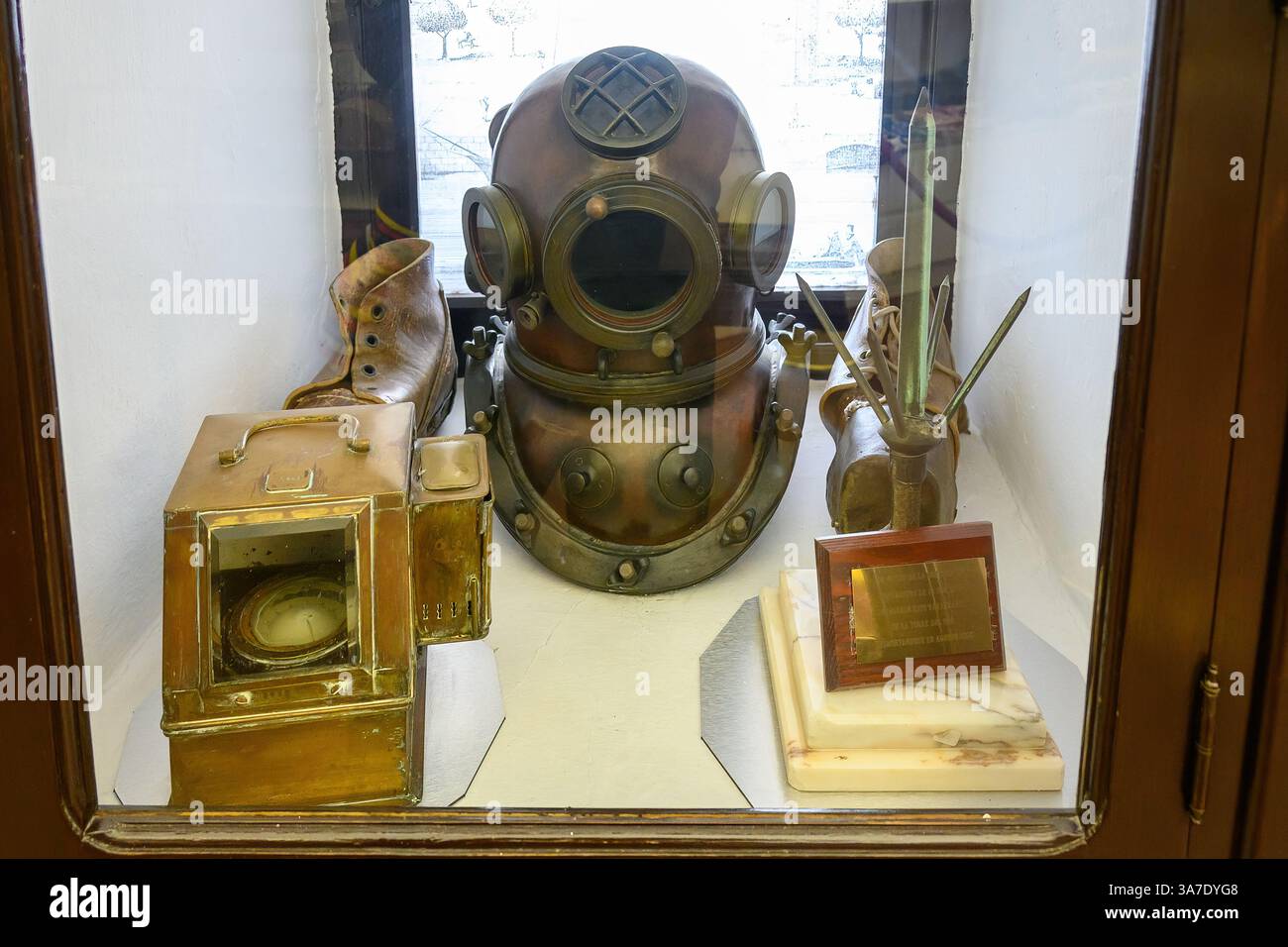 Antique diver helmet on exhibit in the Navy Museum located in the Torre ...