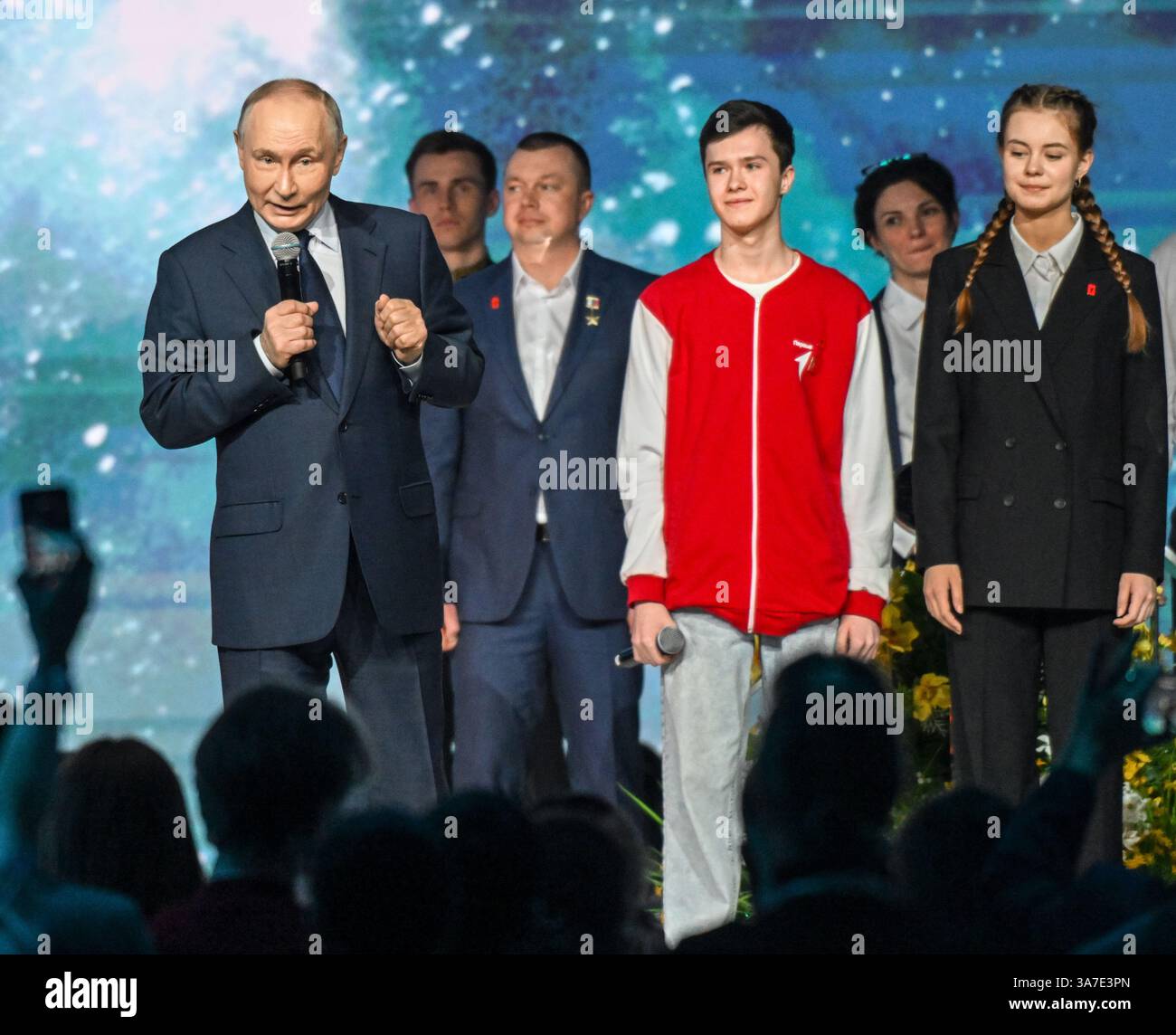 Russian President Vladimir Putin (left) speaking at the congress ...