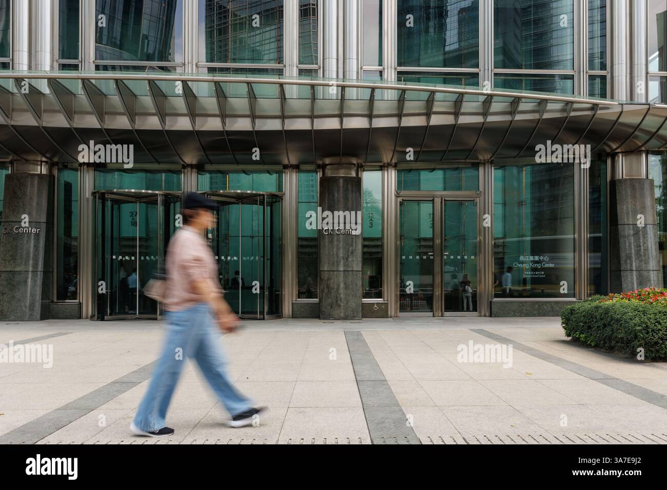 A person walks past Cheung Kong centre, the headquarters of CK ...